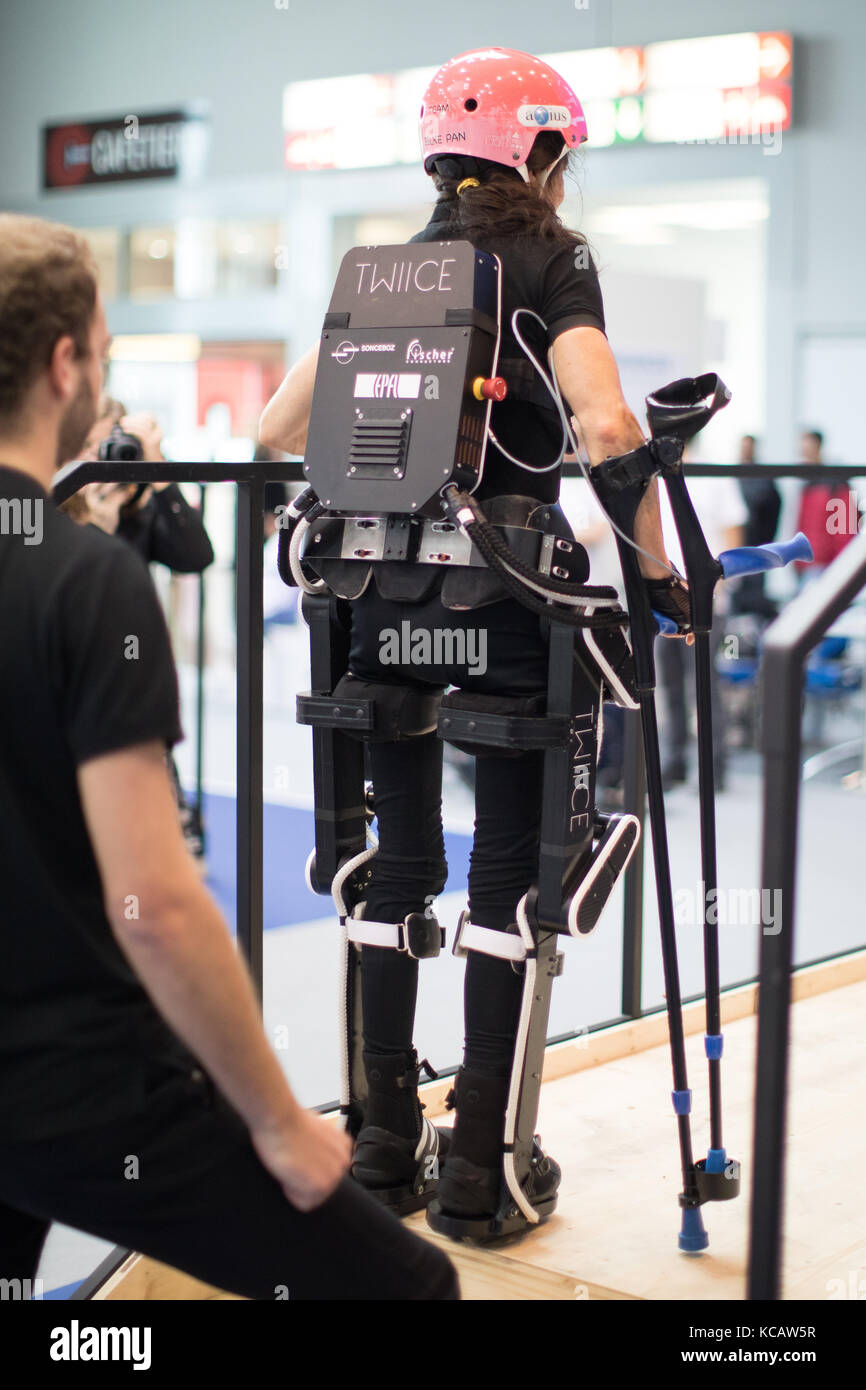 Duesseldorf, Germany. 4th Oct, 2017. A paraplegic woman with a robotic ...