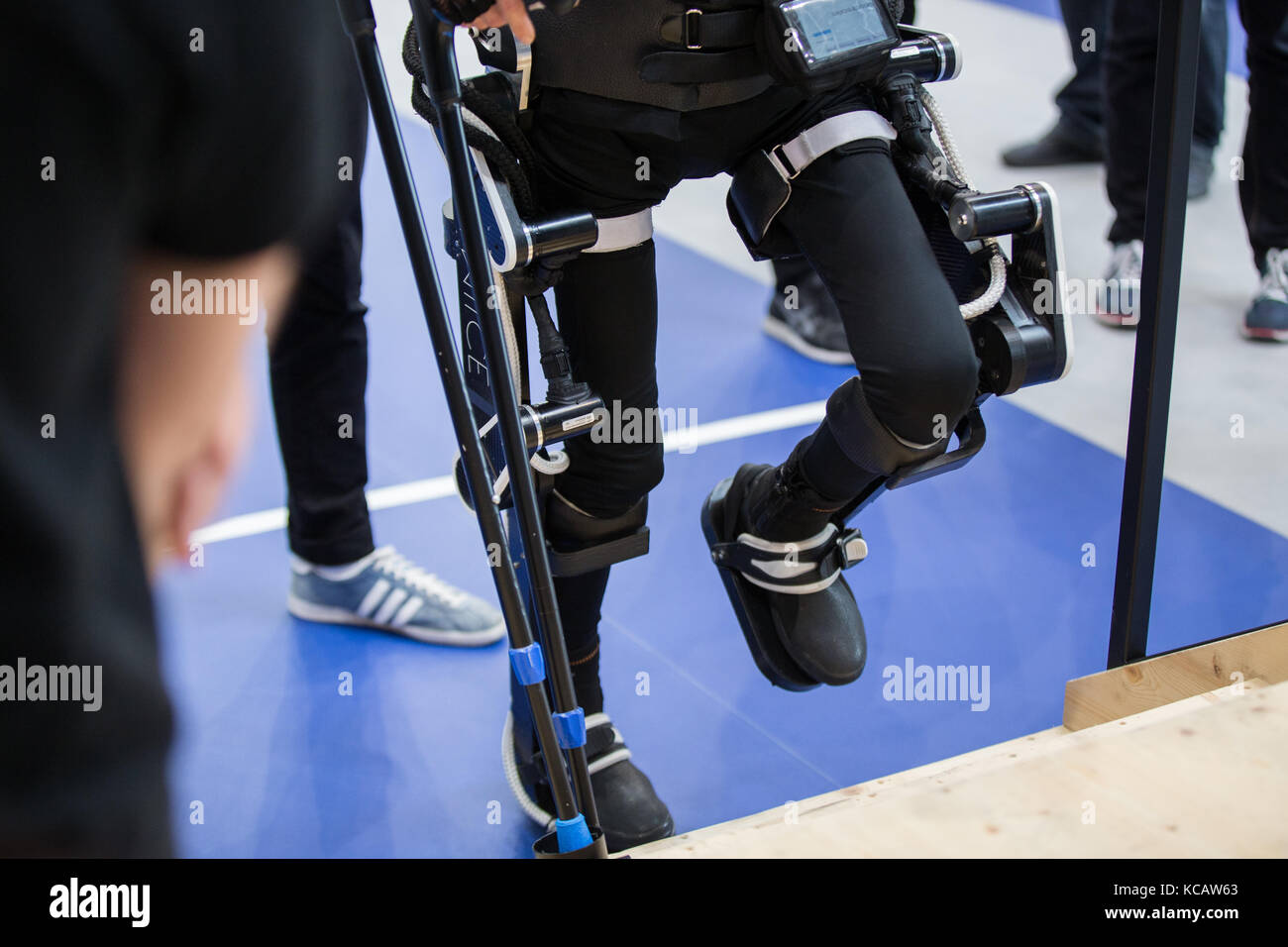 Duesseldorf, Germany. 4th Oct, 2017. A paraplegic woman with a robotic ...