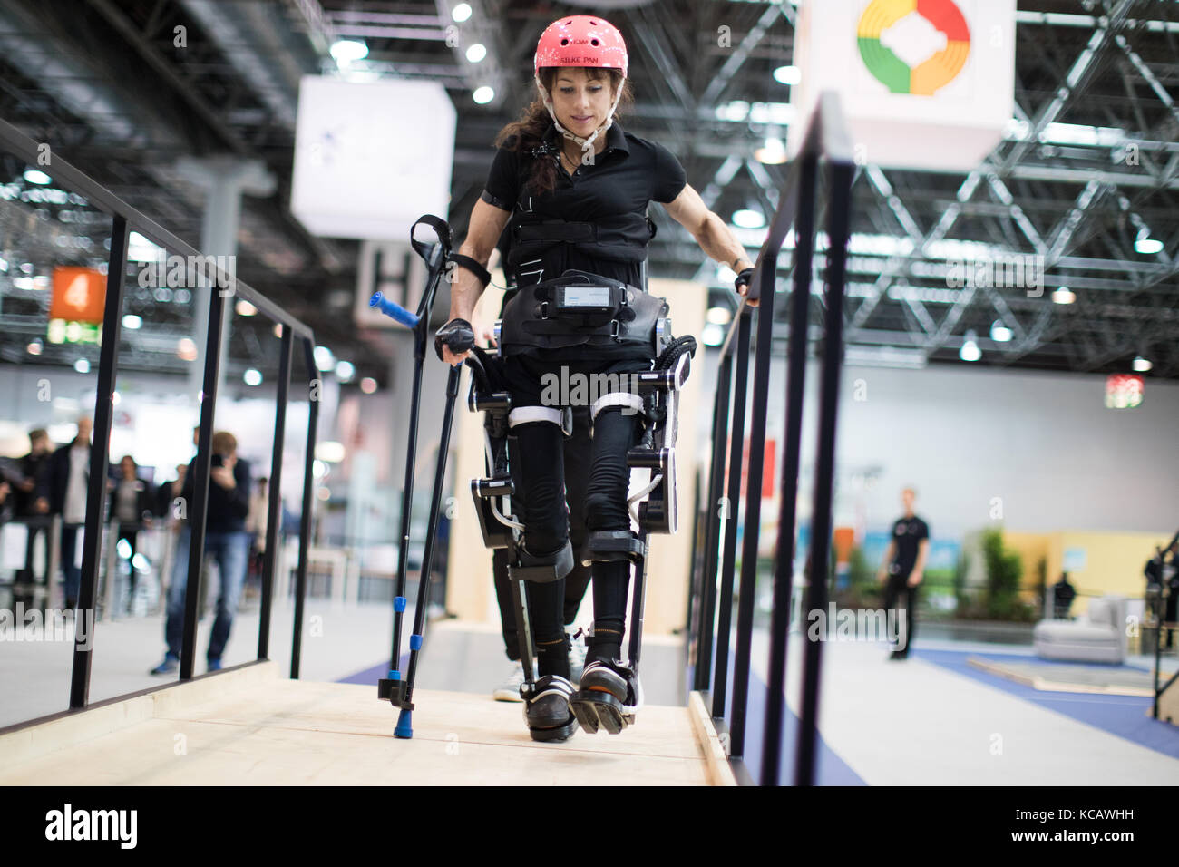 Duesseldorf, Germany. 4th Oct, 2017. A paraplegic woman with a robotic ...