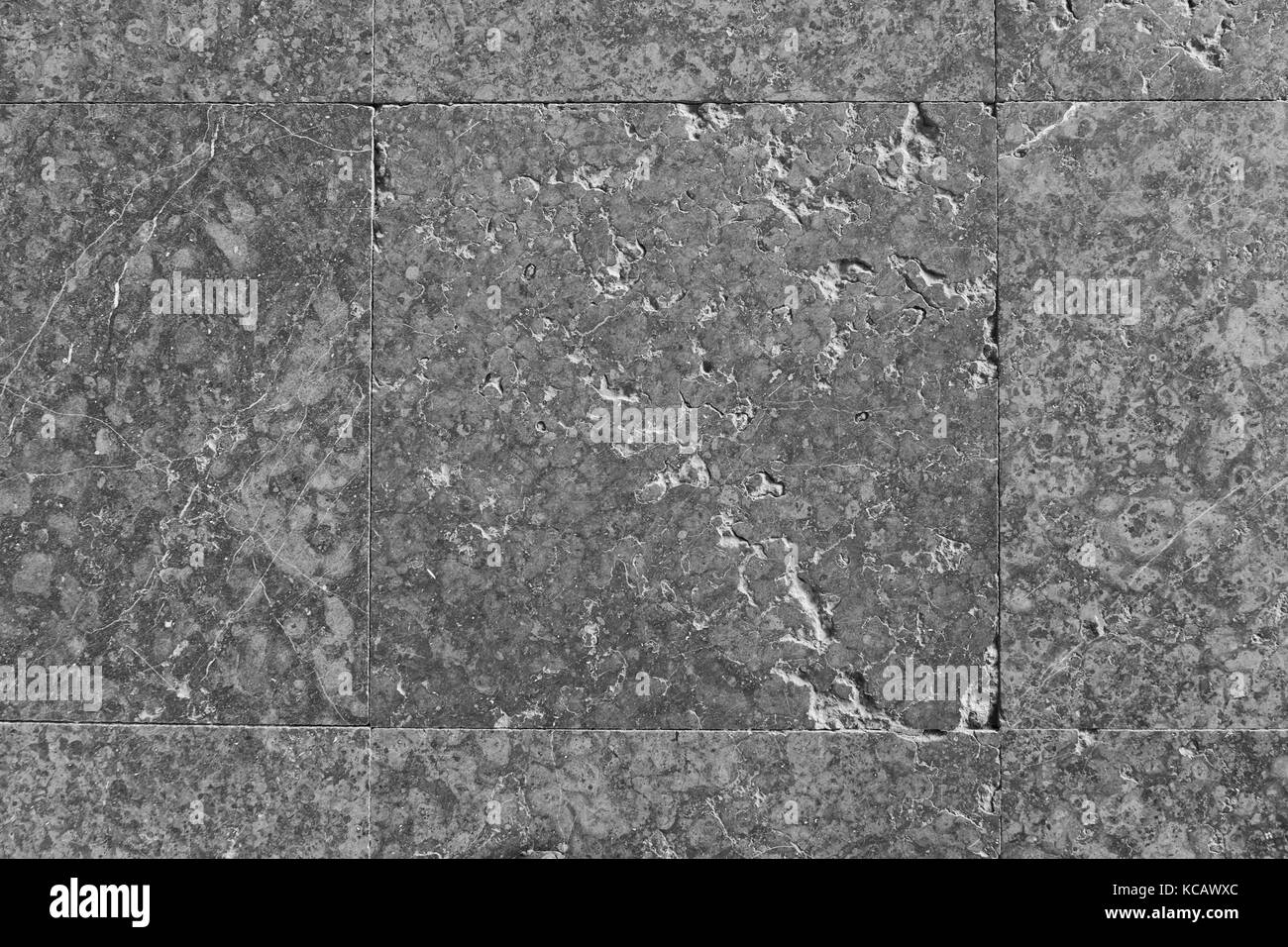 Natural marble stones in old castle hall. Filling with cement into nice ...