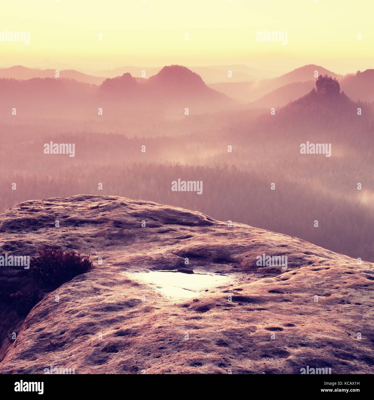 Dreamy spring daybreak above peaks of hilly lanscape with the view into ...