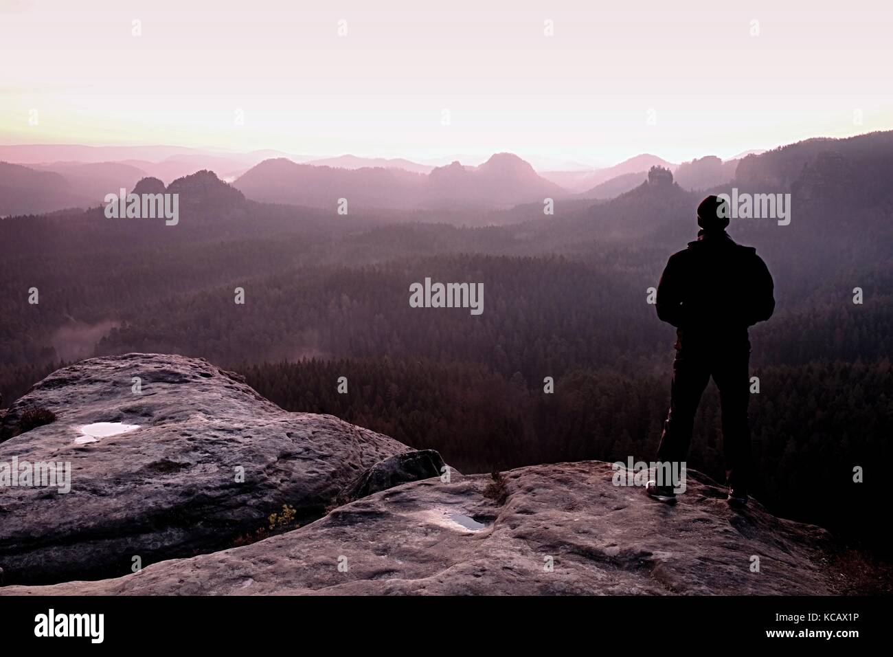 Man on sandstone rock watching to Sun. Beautiful moment the miracle of ...