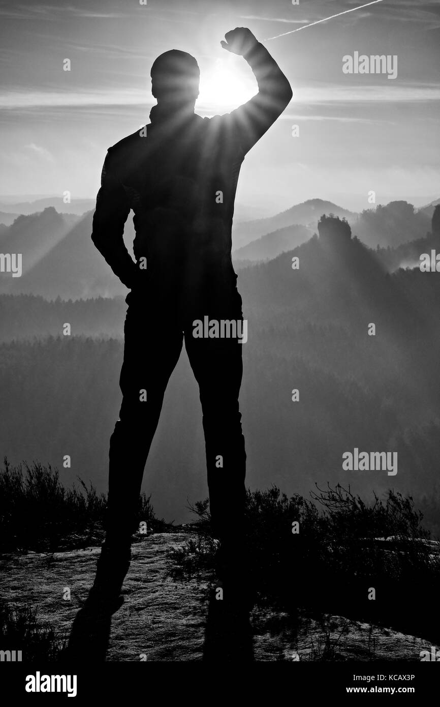 Self confident hiker on the peak of sandstone rock in rock empires park ...