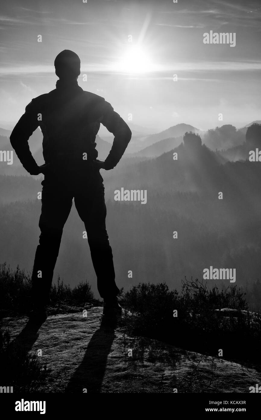 Self confident hiker on the peak of sandstone rock in rock empires park ...
