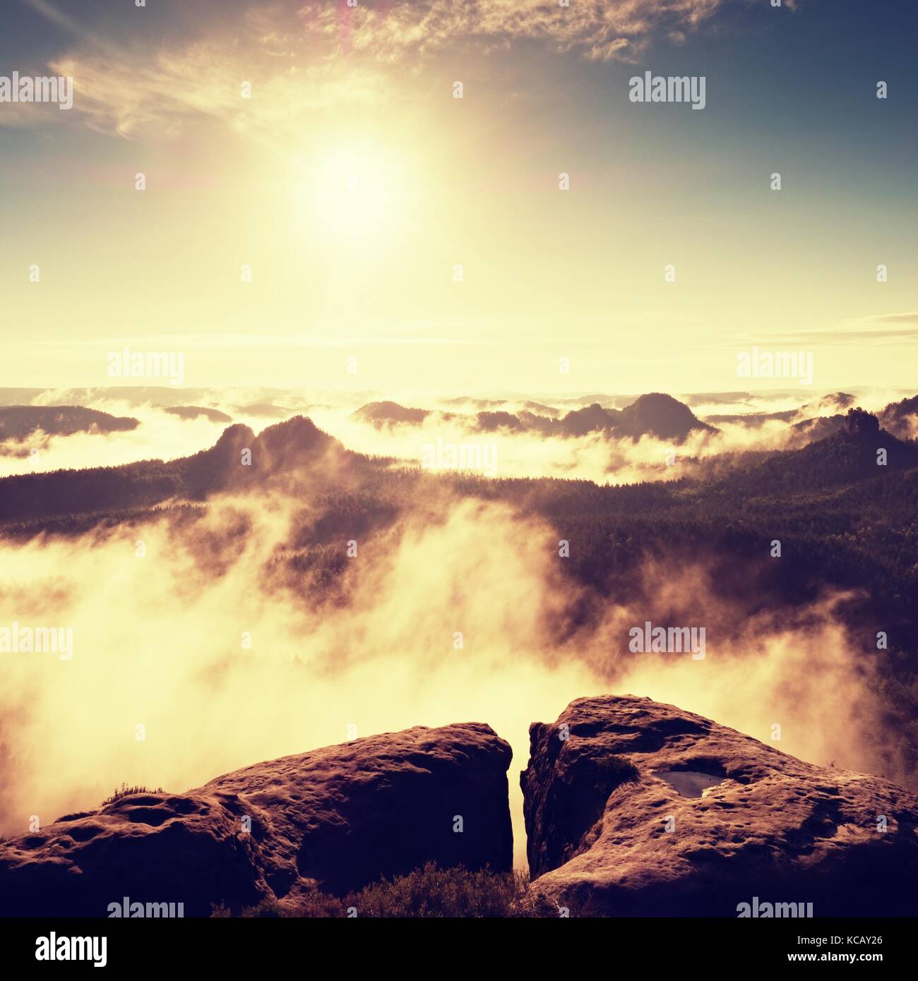 Morning view over sandstone cliff into forest valley, daybreak Sun at ...