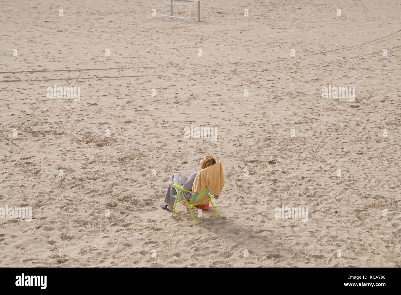 Lady relaxing in a chair at Benidorm, Spain Stock Photo - Alamy