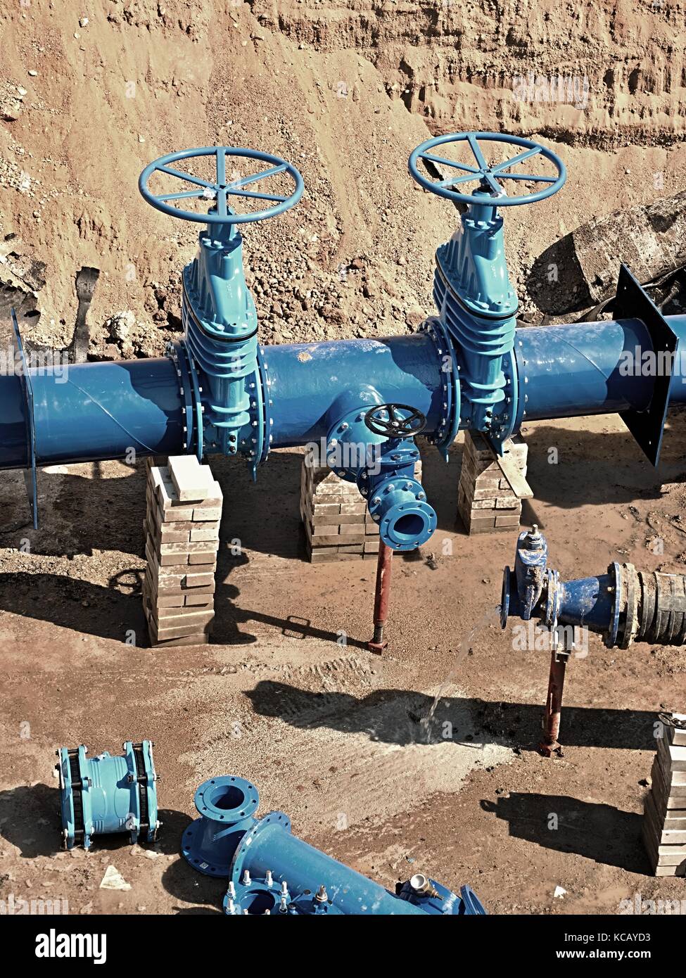 Oil, gas, water industry. Wellhead with valve armature underground. Dug ...