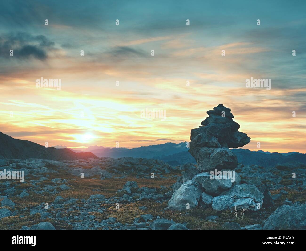 Stacked sharp stones at trail. Heavy white pebbles stack on rocky ...