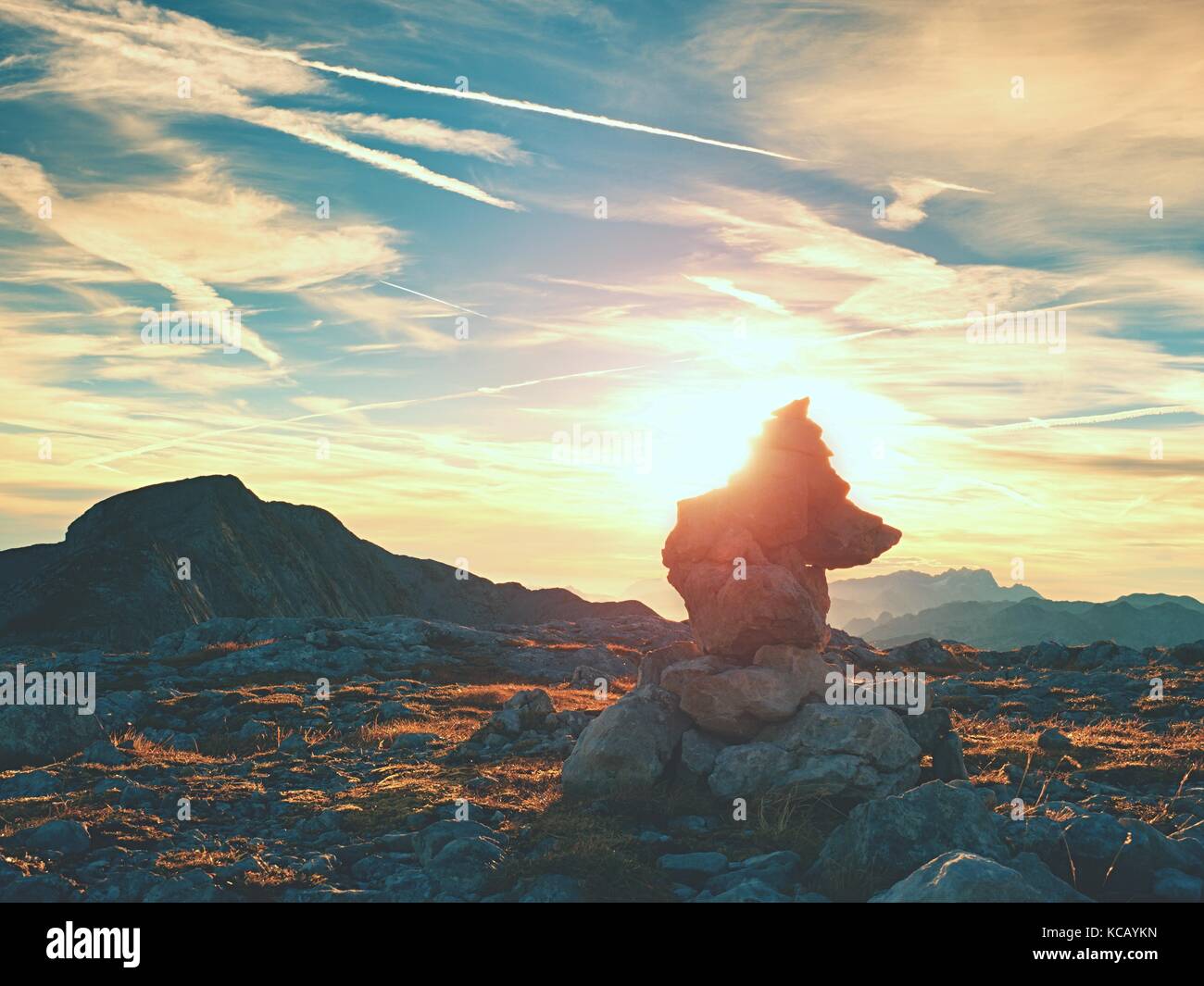 Sharp stones stacked at trail run. Heavy pebbles stack on dry grass on ...