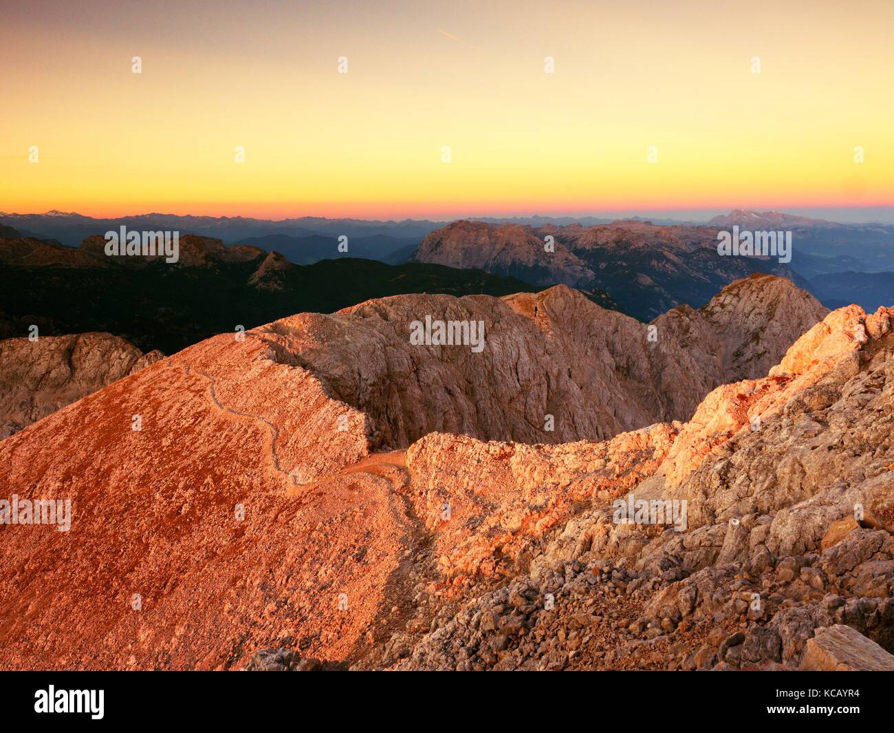 Morning view over Apine cliff and valley.Daybreak Sun at horizon ...