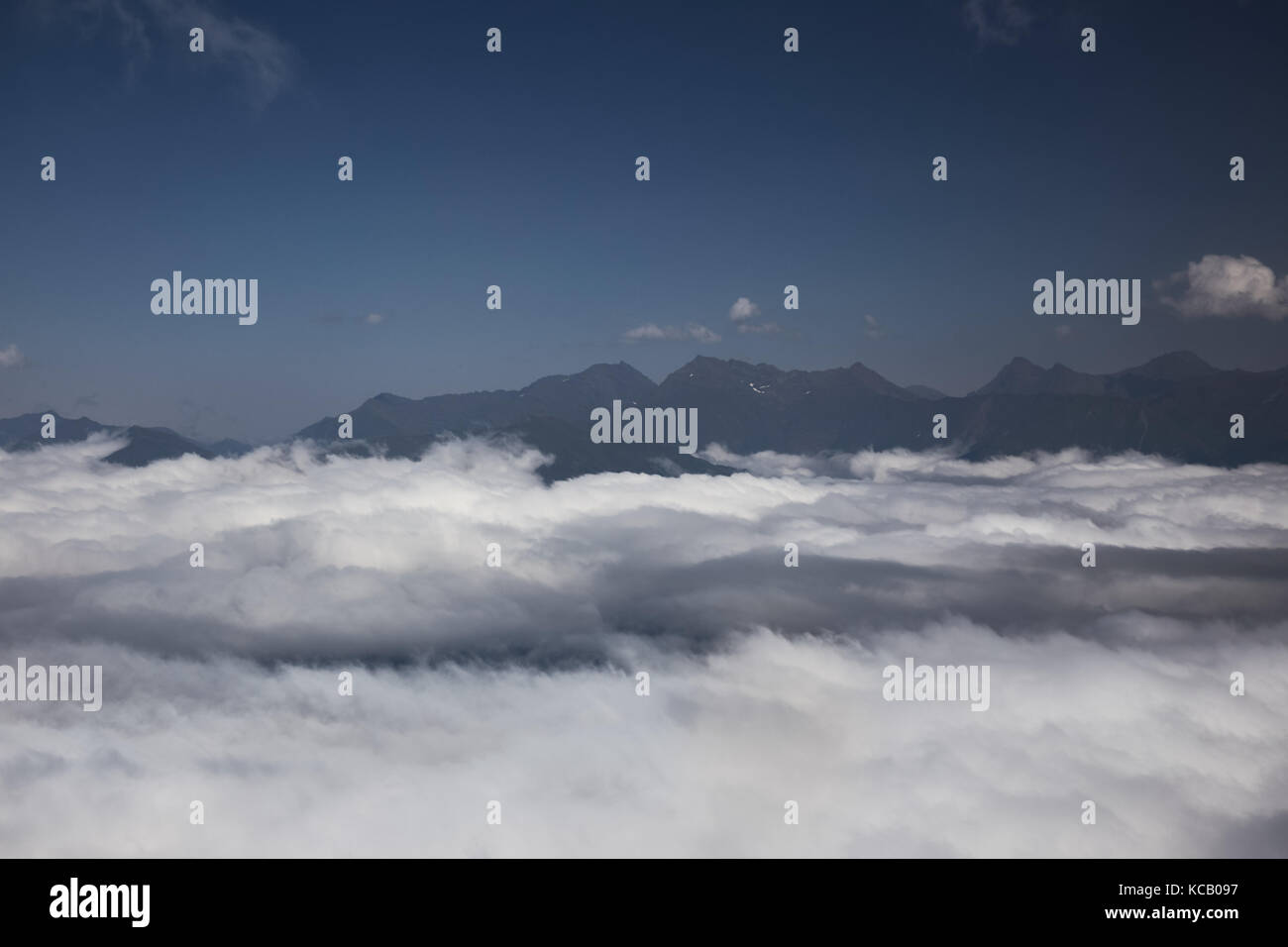 Beautiful clouds and fog among mountain landscape Stock Photo - Alamy