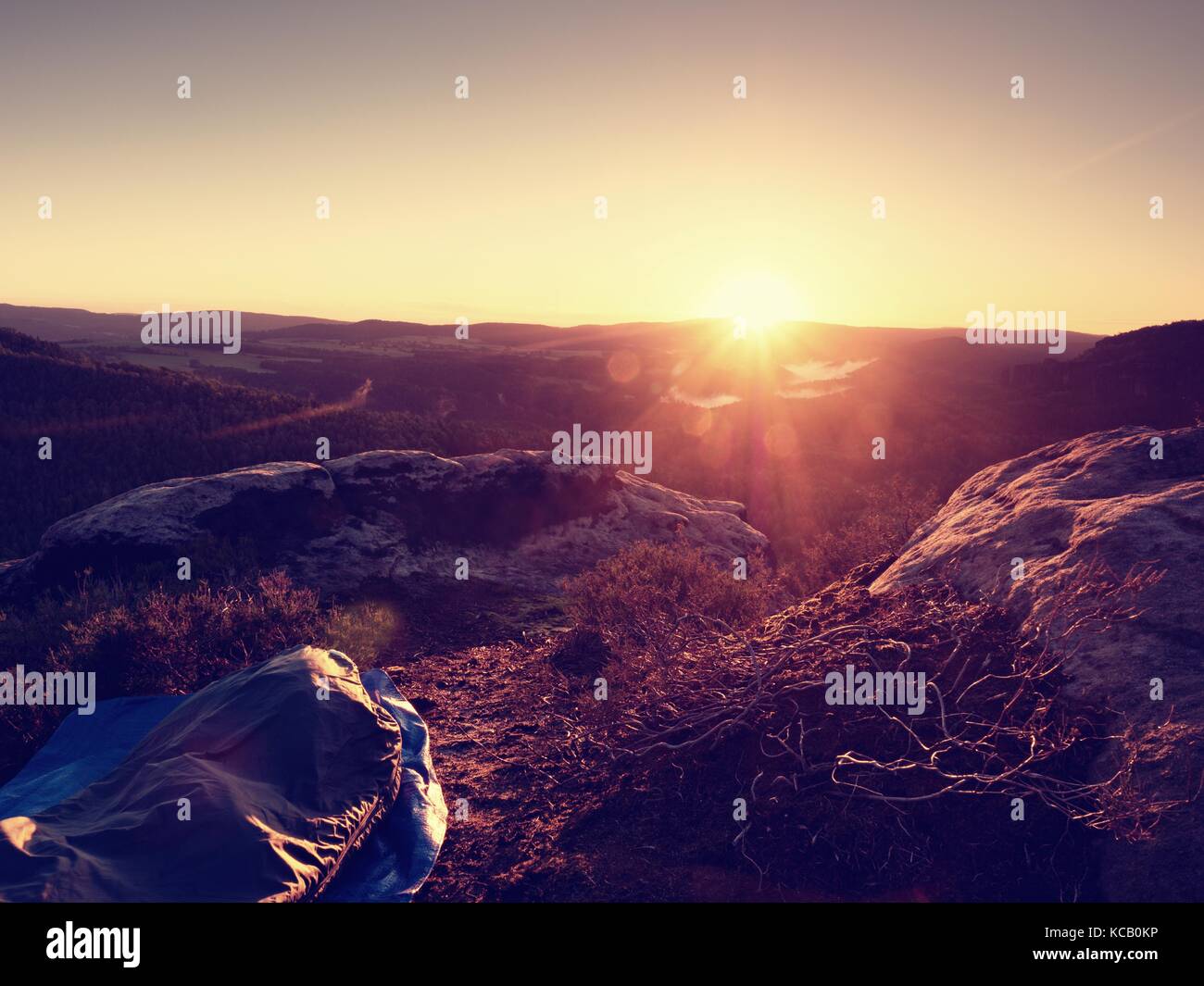 Beautiful awakening in rocks. Sleeping in nature in sleeping bag. View ...