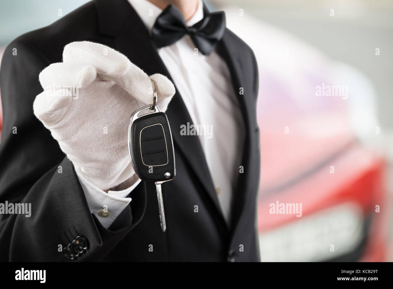 Close-up Of A Valet Boy Holding A Car Key Outside The Car Stock Photo ...