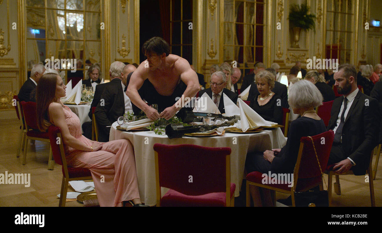 THE SQUARE, Terry Notary (on table), 2017 © Magnolia Pictures /Courtesy ...