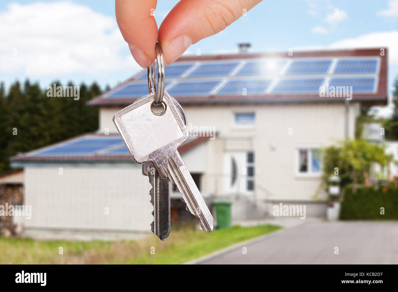 Close-up Of The Owner Hand Holding The Key Of The House Stock Photo - Alamy