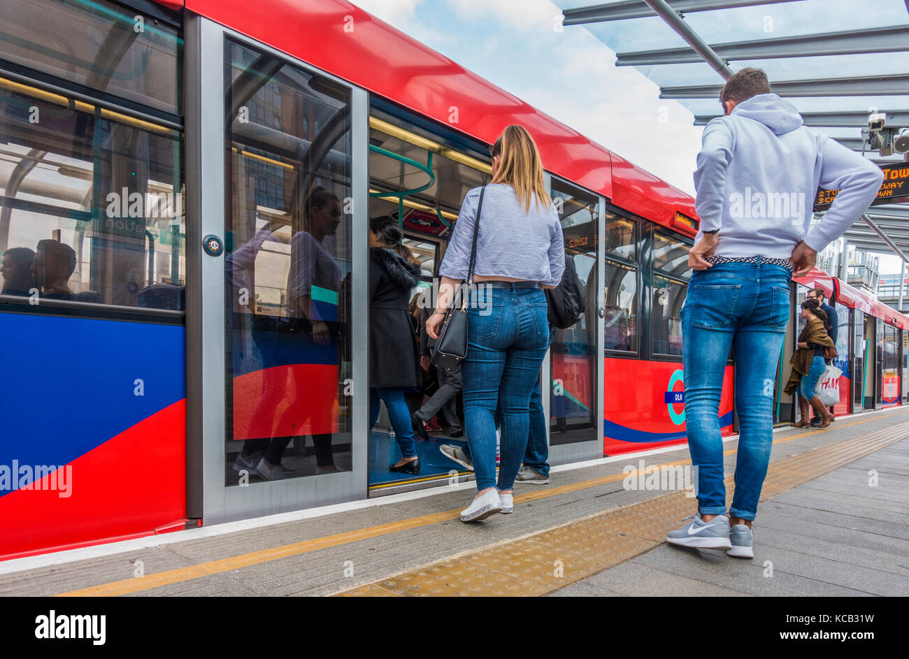 Passengers / commuters boarding a train during daytime, at Royal ...