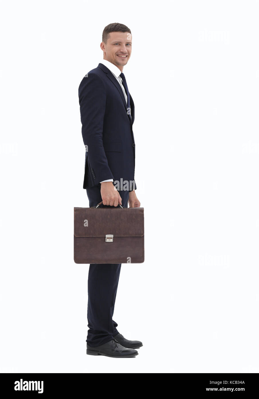 confident businessman with briefcase. side view Stock Photo - Alamy