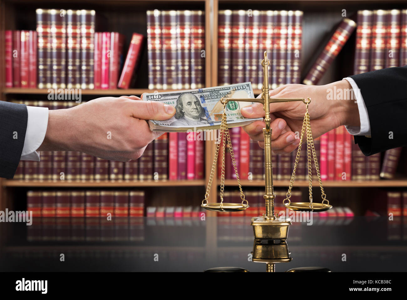 Close-up Of A Justice Scale On Table With Judge Taking Bribe From ...