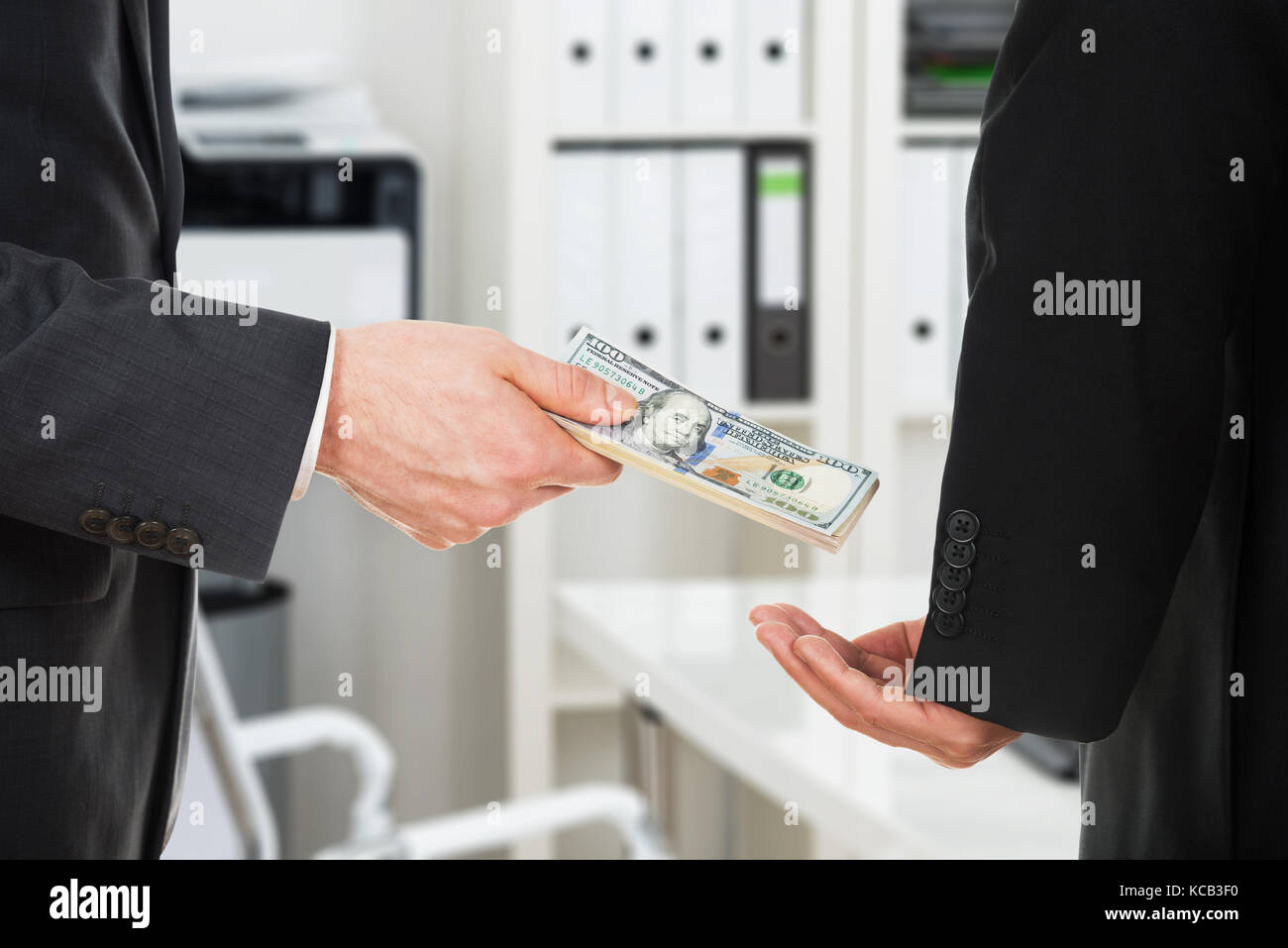 Businessman counting money table in hi-res stock photography and images ...