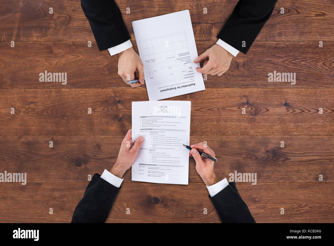 High Angle View Of A Businessman Conducting An Employment Interview ...