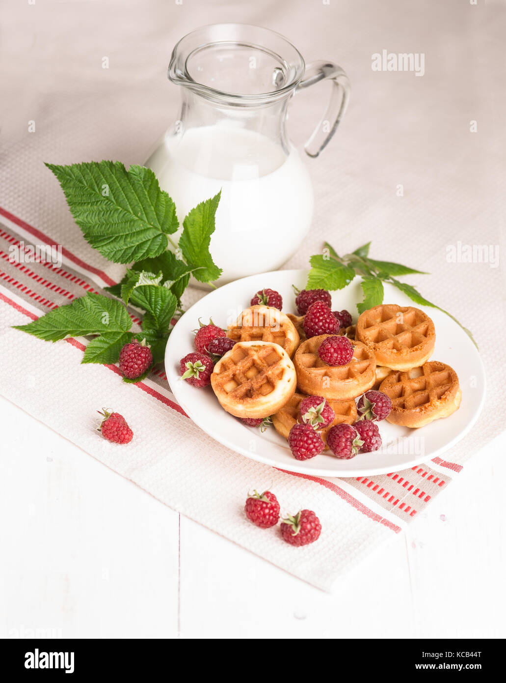 raspberry, milk in a jar and cookies Stock Photo - Alamy