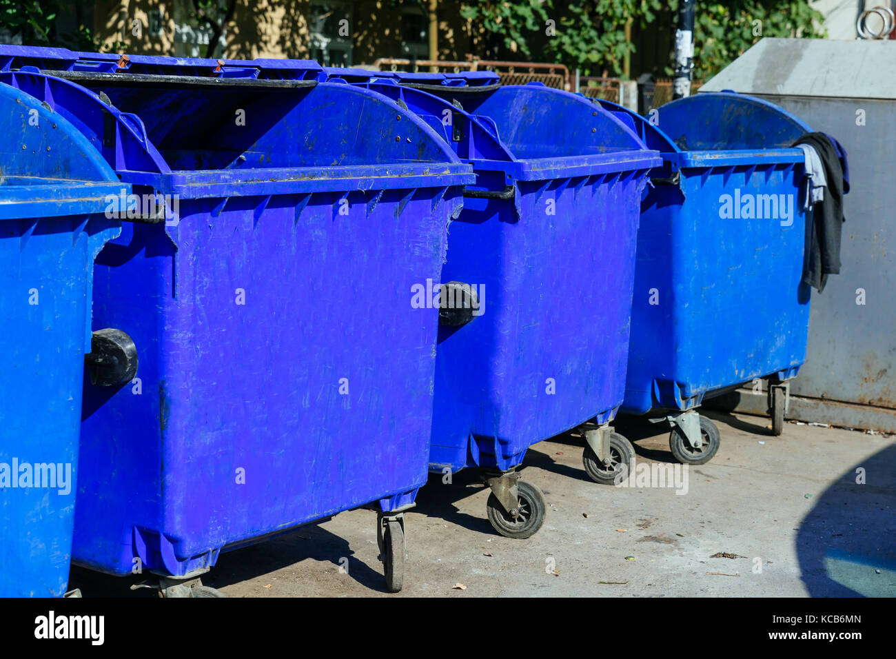 trash cans standing in a row bin Many blue tanks Stock Photo - Alamy