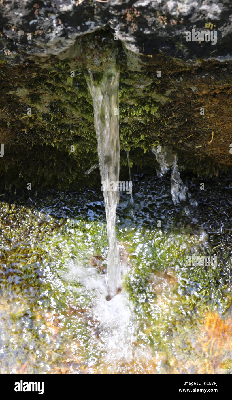 Ancient fountain made of stone and drinking water flowing Stock Photo ...