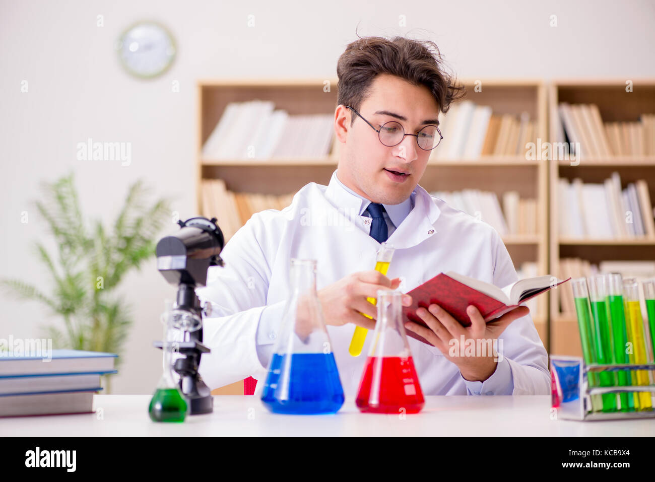 Mad crazy scientist doctor doing experiments in a laboratory Stock ...