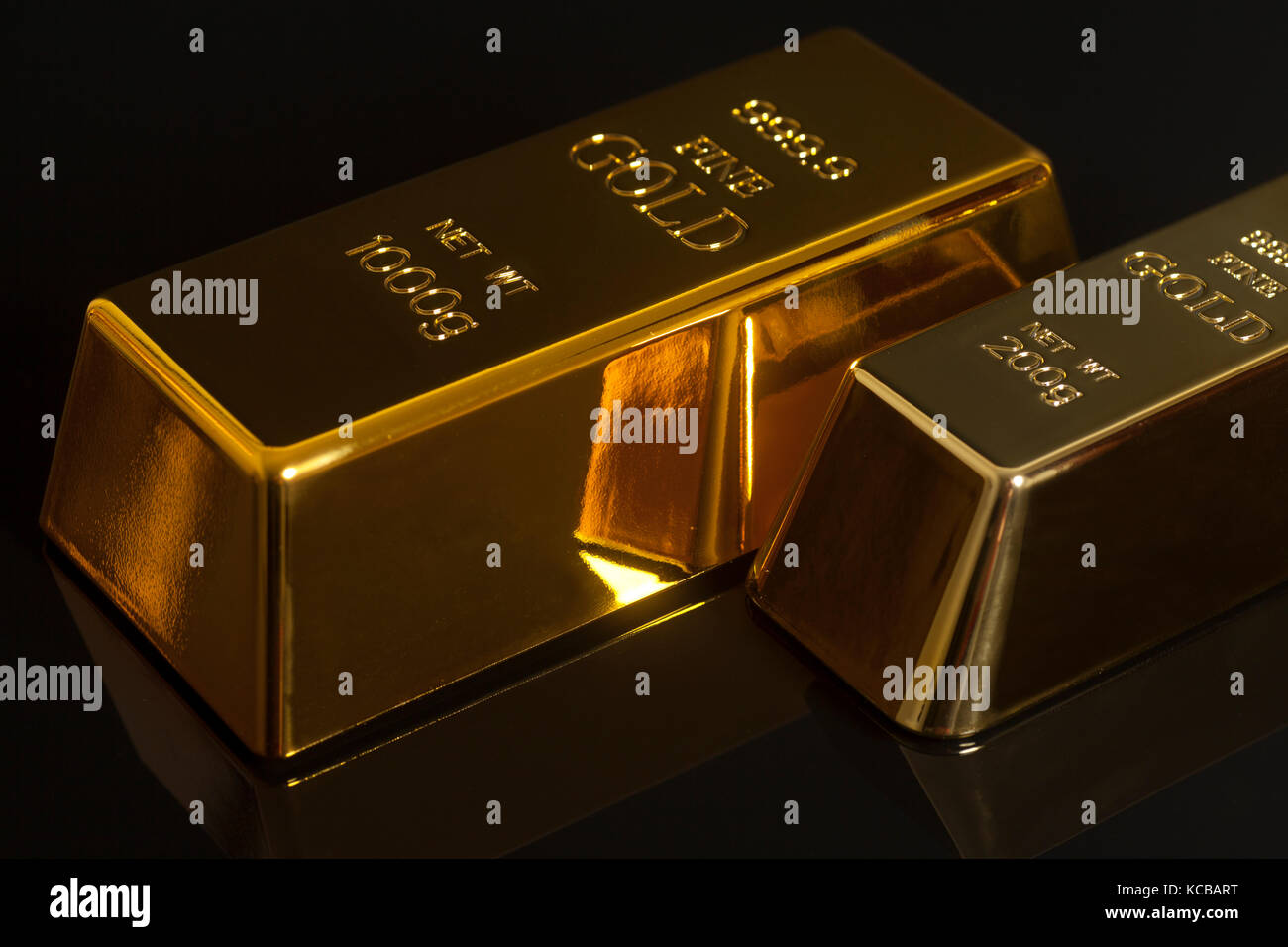 Gold bullion on black background Stock Photo - Alamy