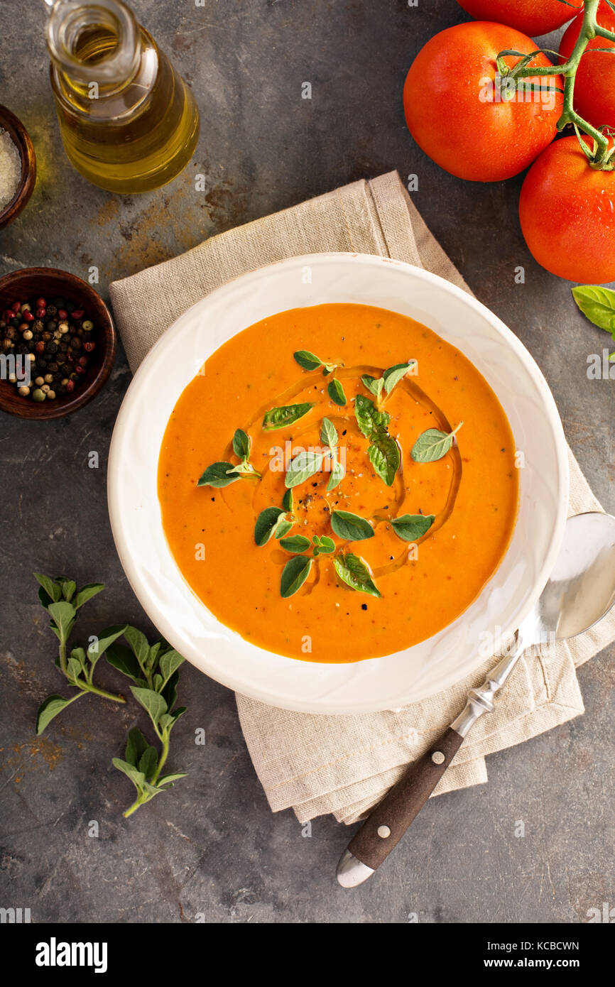 Tomato soup with olive oil and herbs Stock Photo - Alamy
