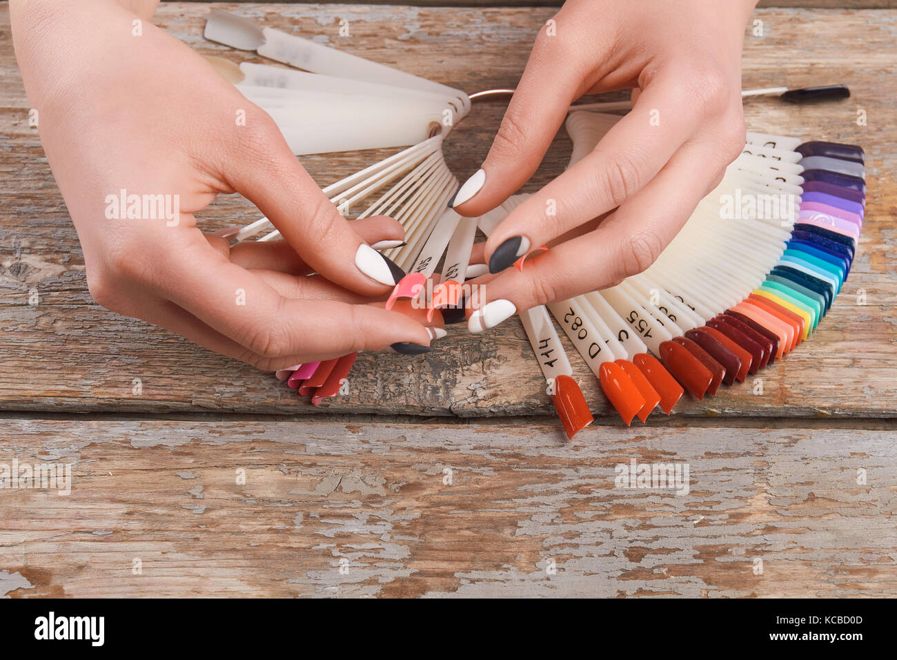 Woman hands holding summer nail samples Stock Photo - Alamy