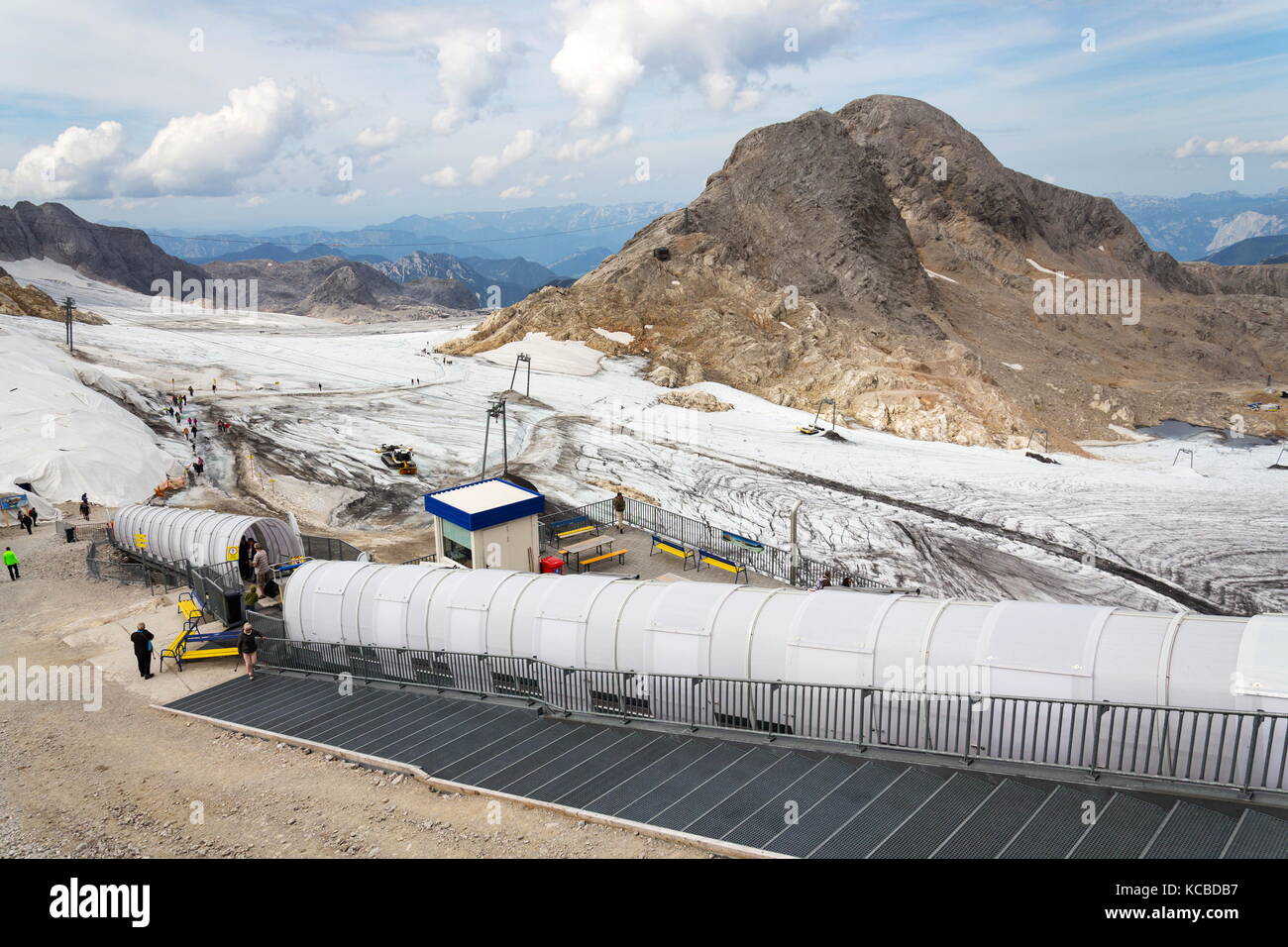 RAMSAU AM DACHSTEIN, AUSTRIA - AUGUST 17: Ski lift with people walking ...