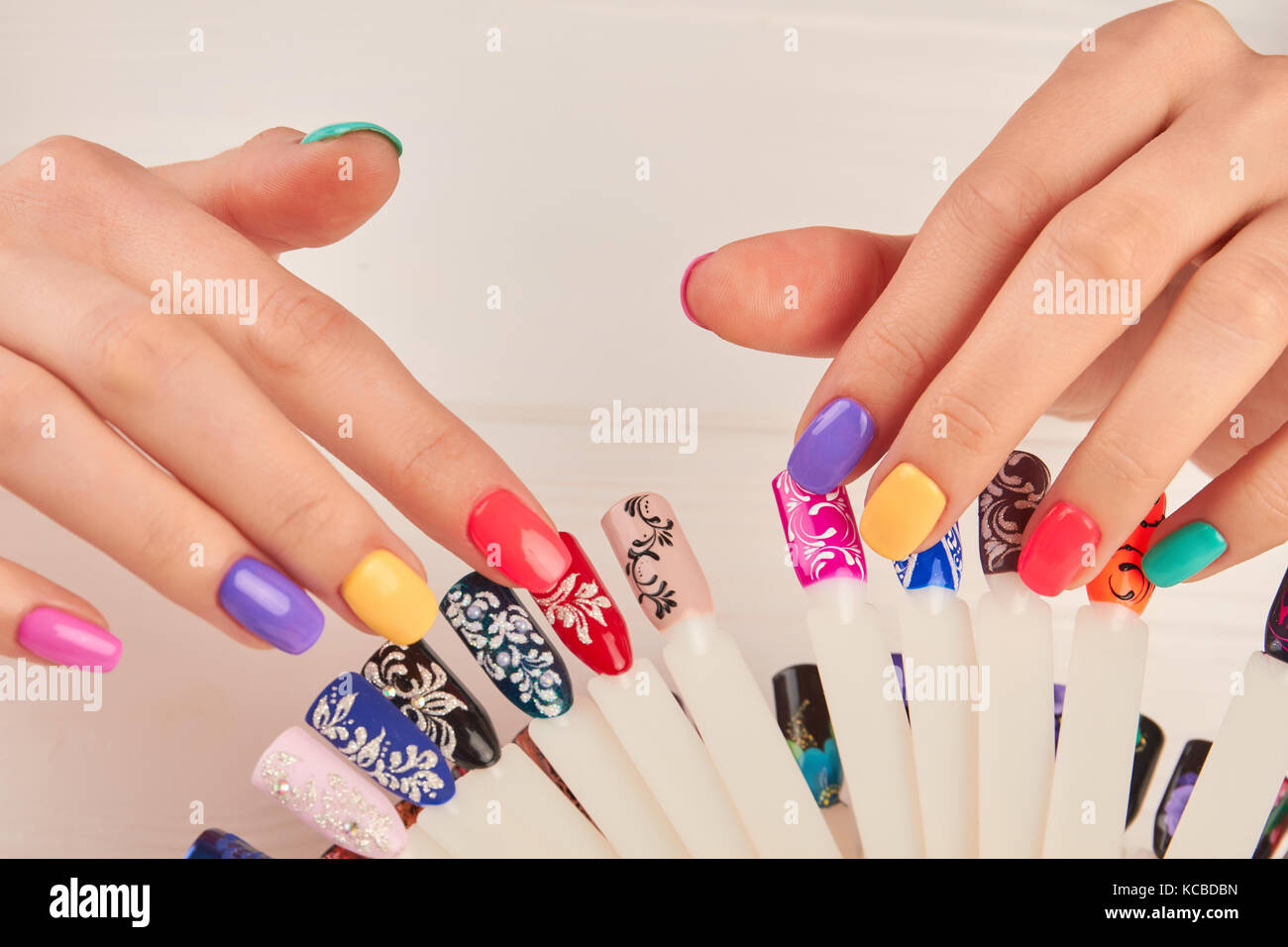 Manicured hands and polish color samples Stock Photo - Alamy