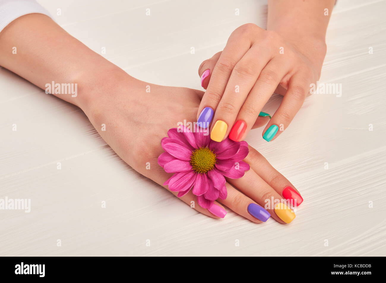 Young woman hands and flower Stock Photo - Alamy