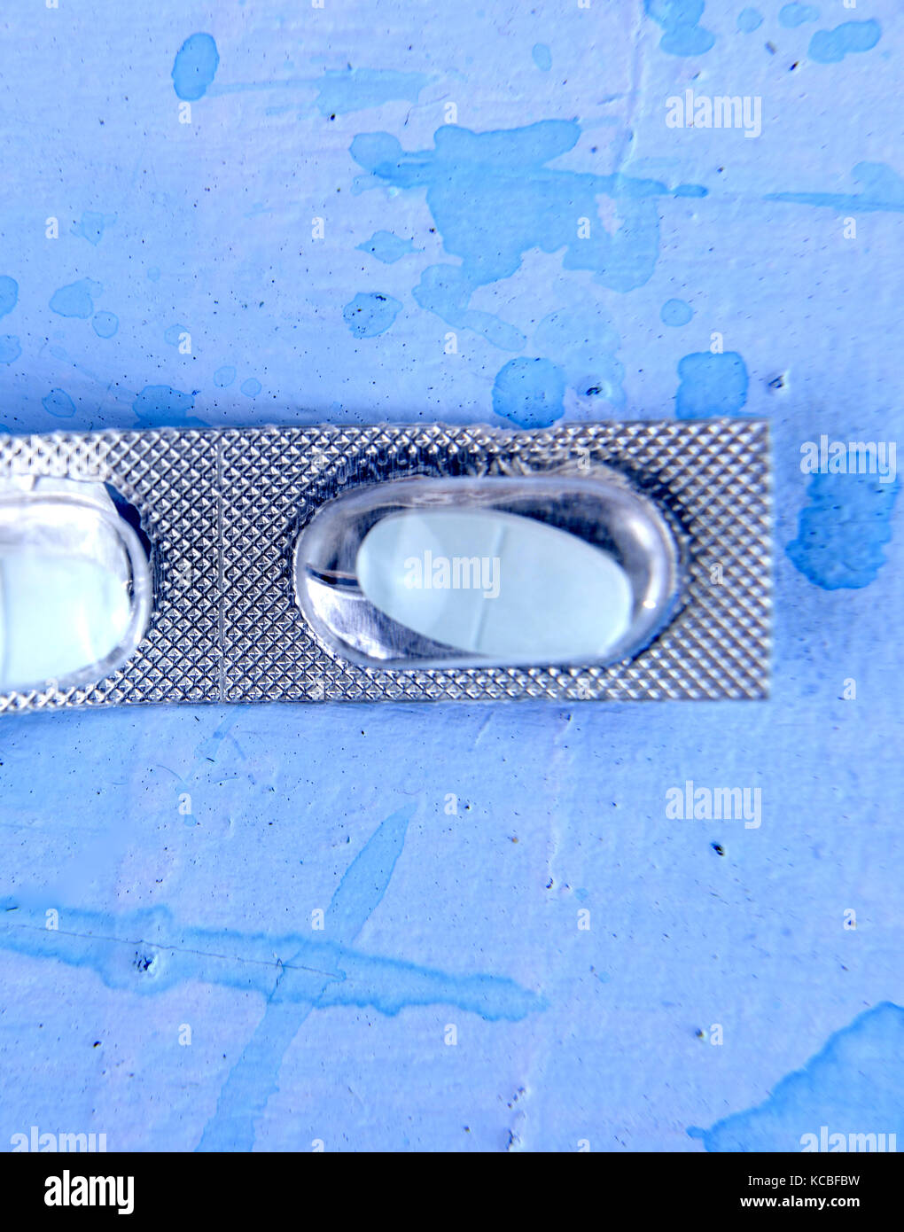 blue pills in a blister packaging, image of a Stock Photo - Alamy