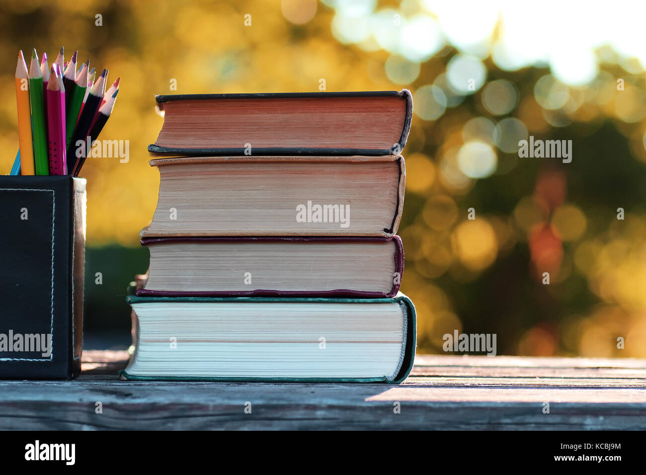 autumn book stack wooden outdoor Stock Photo - Alamy