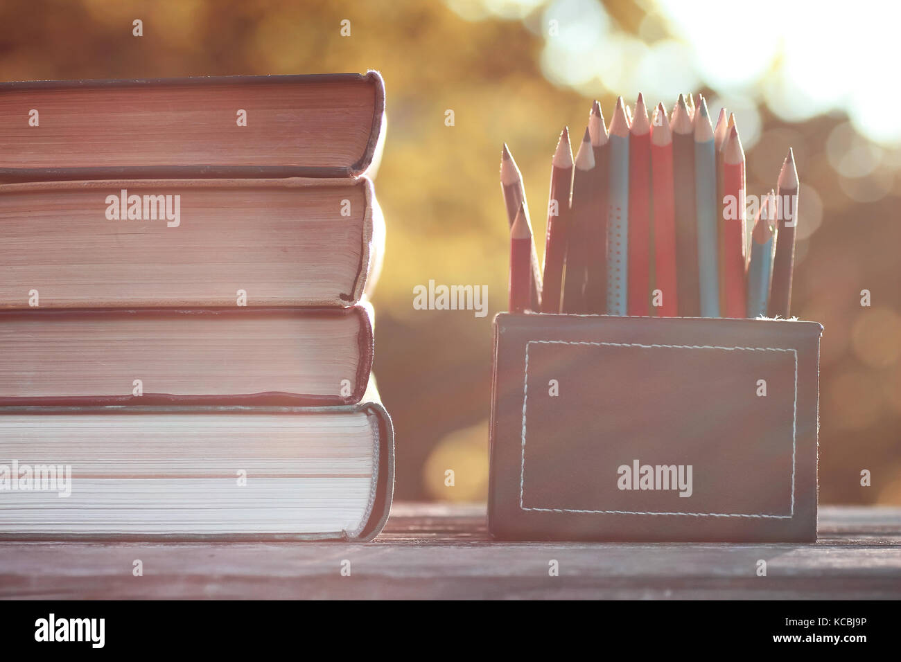 autumn book stack wooden outdoor Stock Photo - Alamy