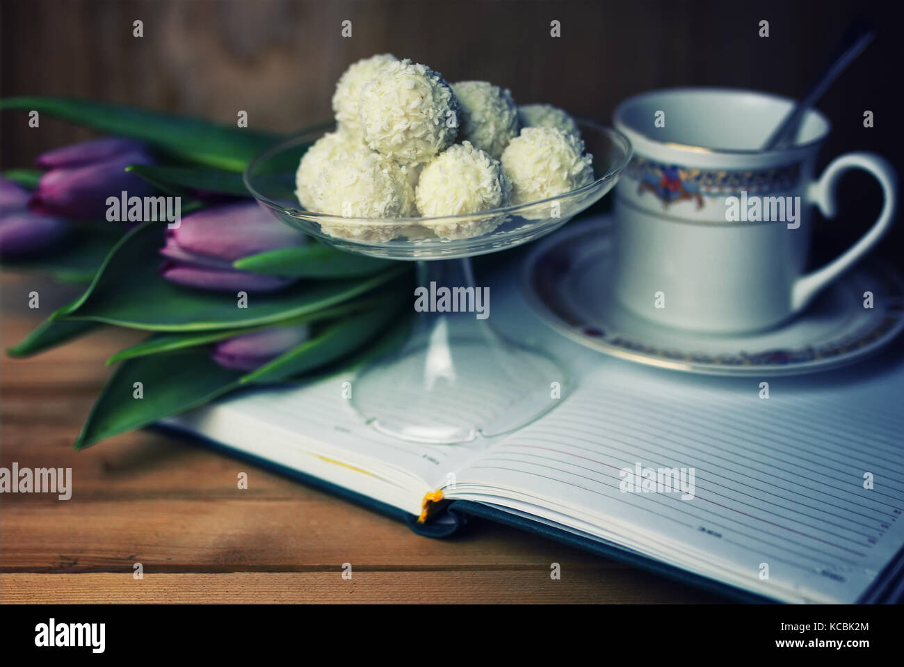 reading book with tea flower and sweet Stock Photo - Alamy