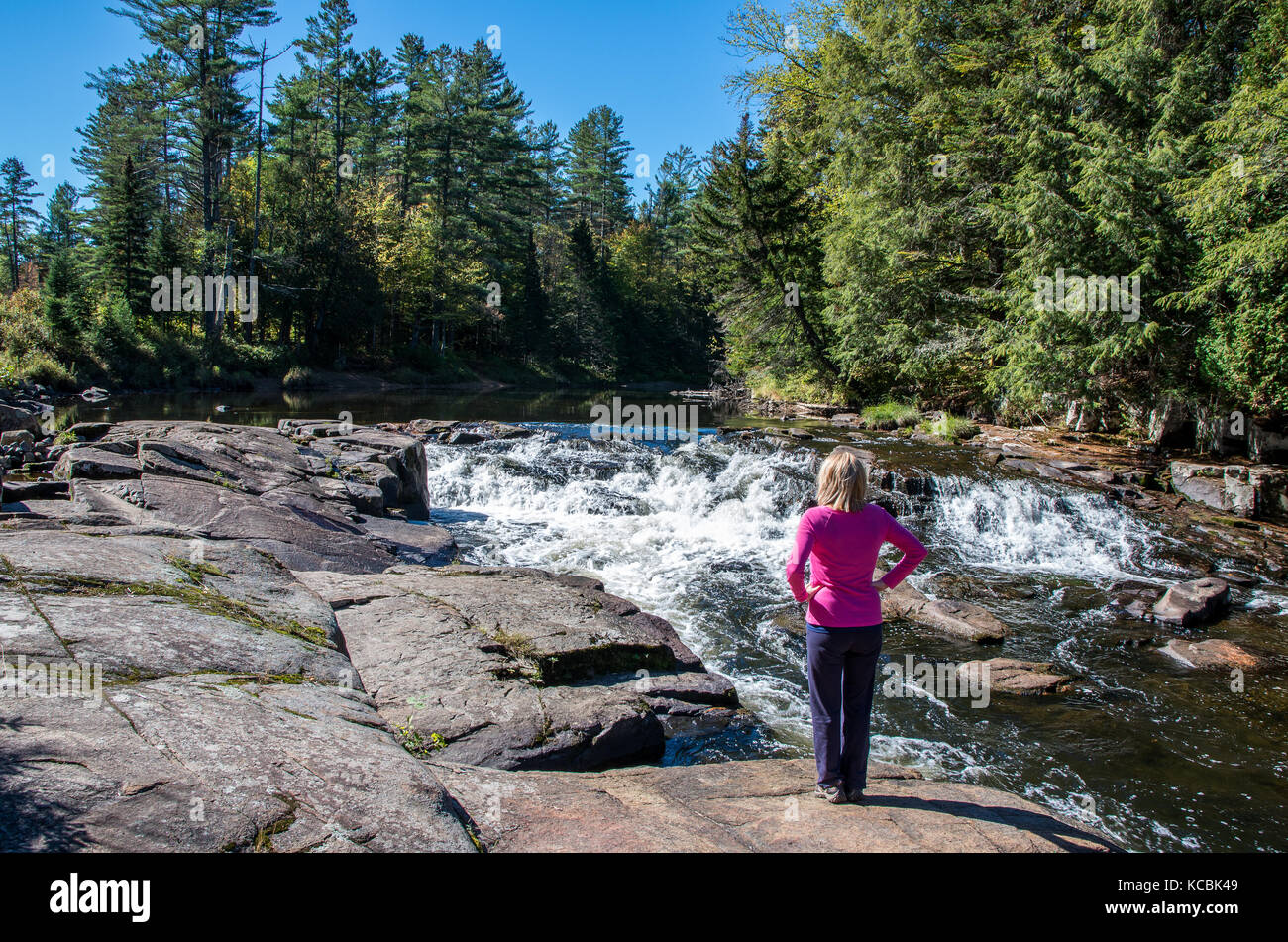 Woman standing on ledge hi-res stock photography and images - Alamy
