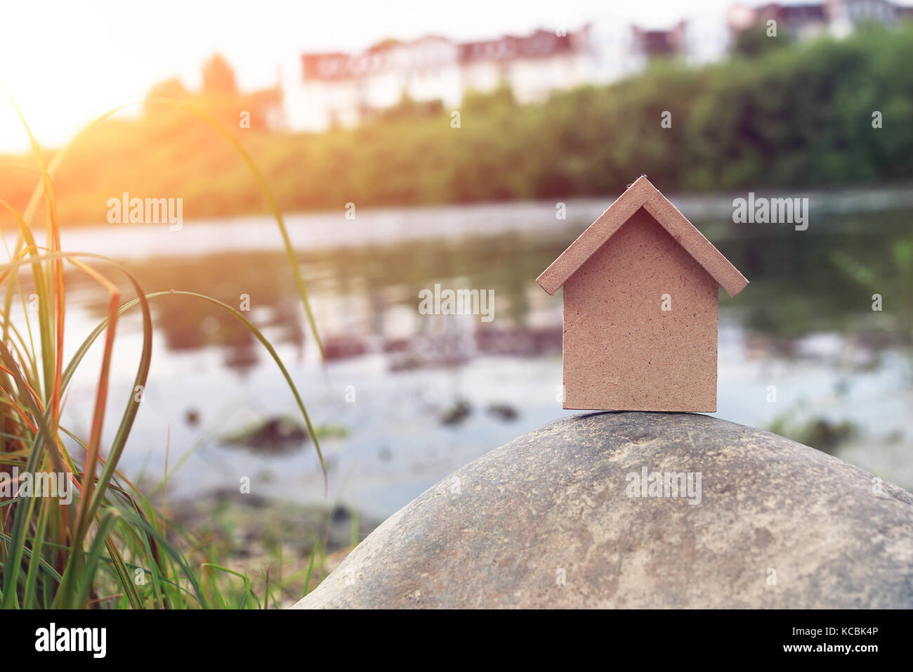 In the shape of a house a wooden figure Stock Photo - Alamy