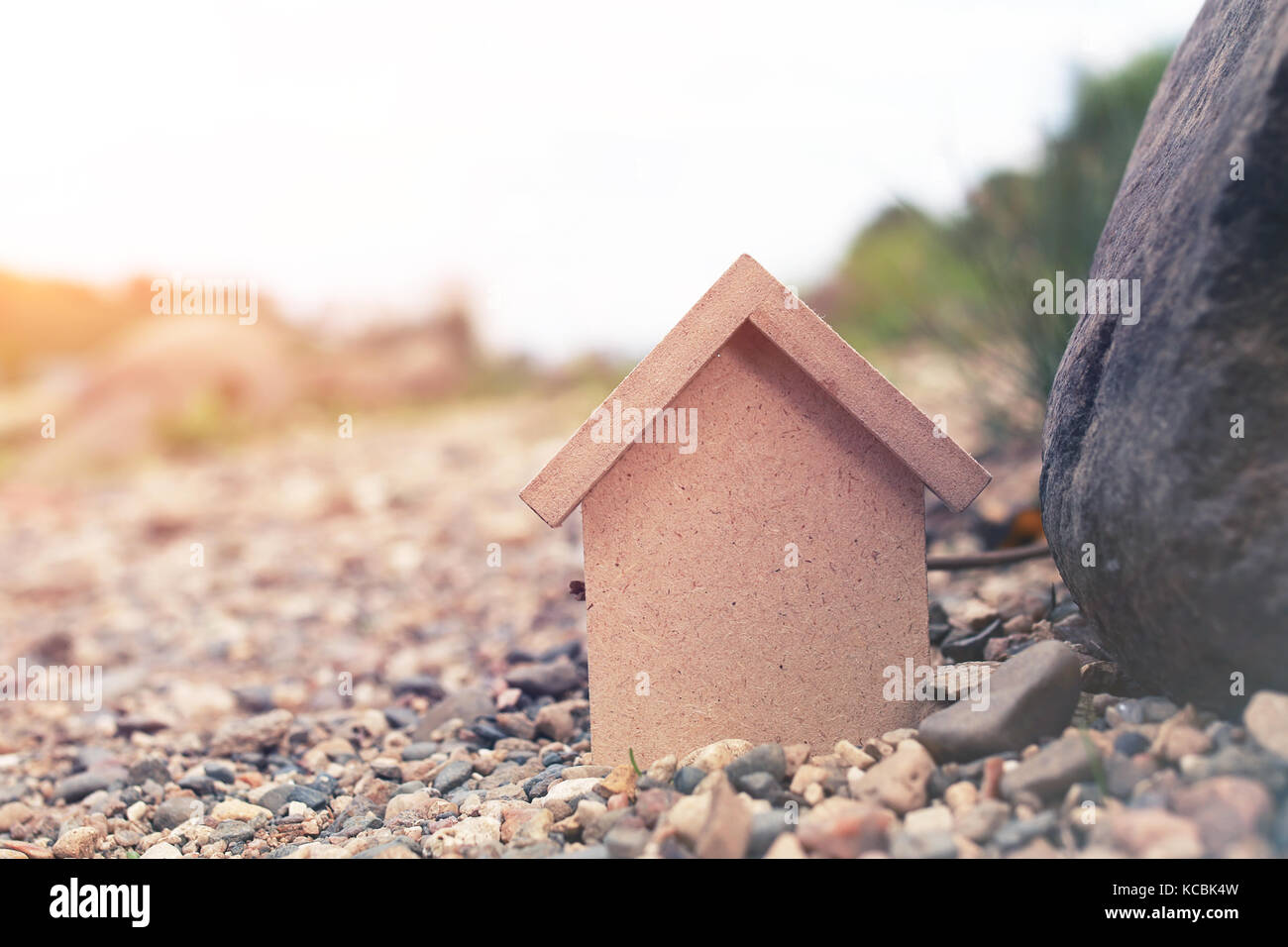 In the shape of a house a wooden figure Stock Photo - Alamy