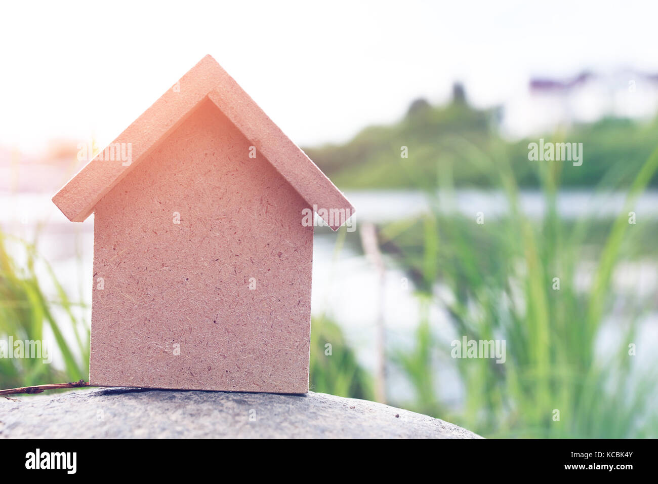 In the shape of a house a wooden figure Stock Photo - Alamy