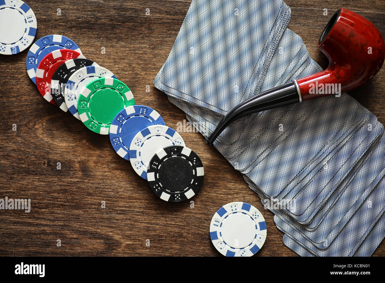 Playing chips and a deck of cards Stock Photo - Alamy