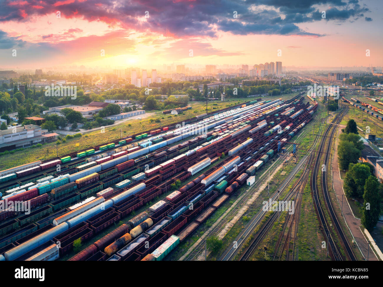 Cargo trains. Aerial view of colorful freight trains. Railway station ...