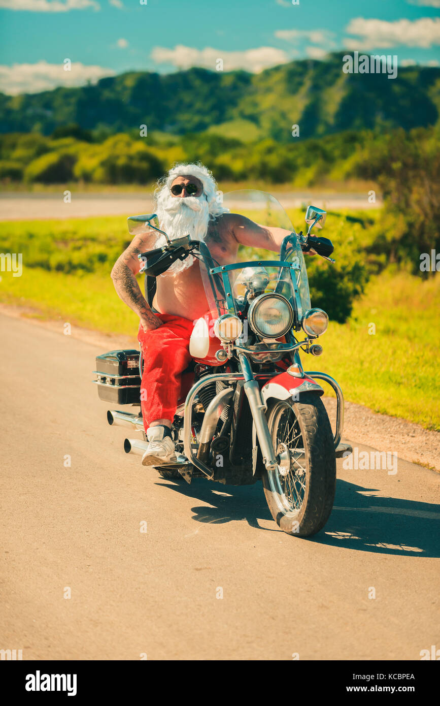 Santa on a motorcycle Stock Photo - Alamy