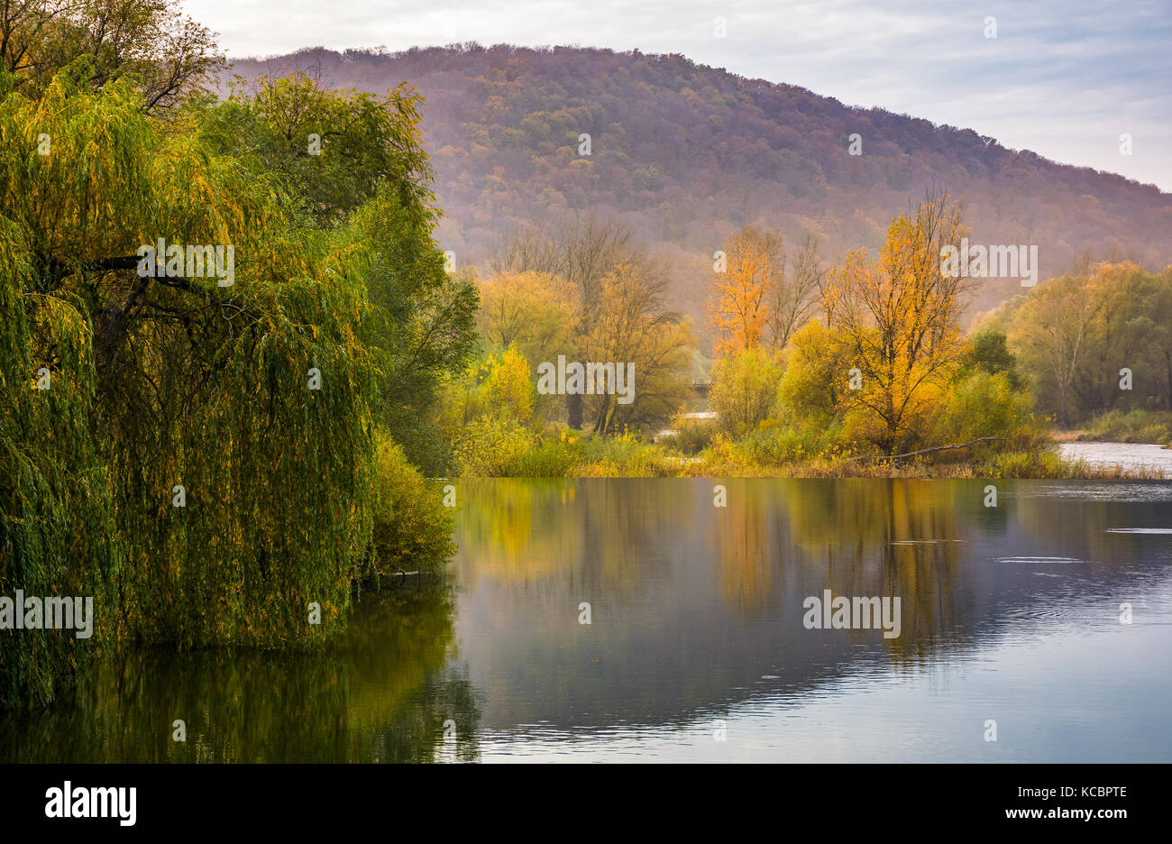 landscape with calm river in autumn. beautiful mountainous scenery with ...