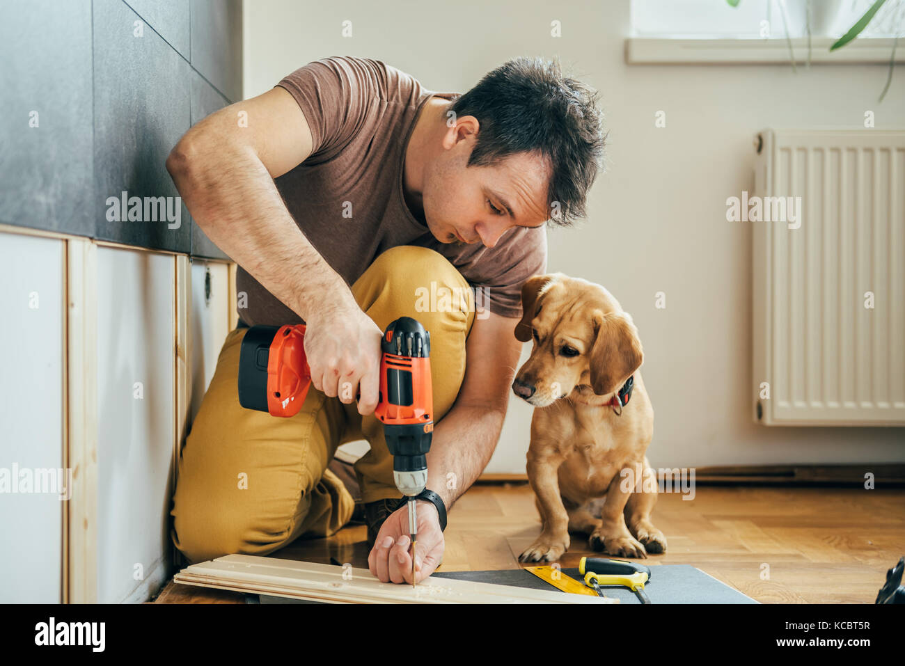 Man doing diy hi-res stock photography and images - Alamy