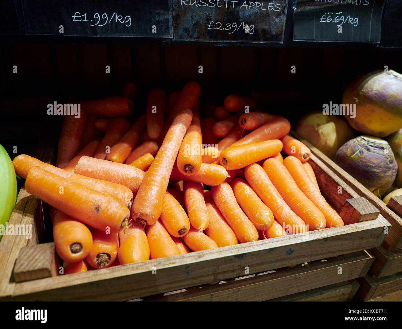 Carrots on a shelf at a farm shop, England, UK Stock Photo - Alamy