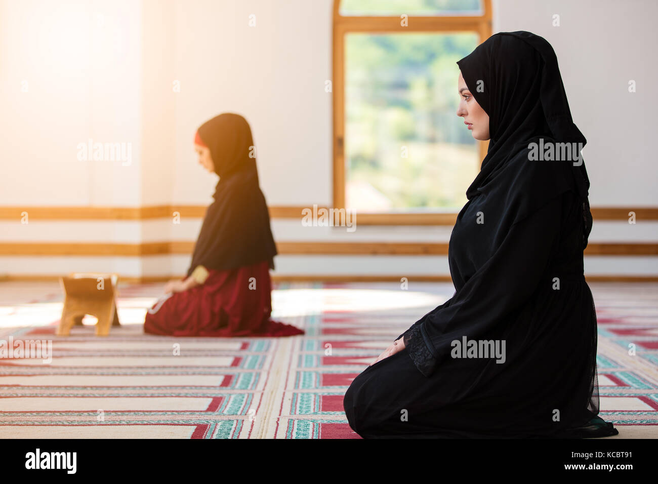 Two Muslim women praying Stock Photo - Alamy