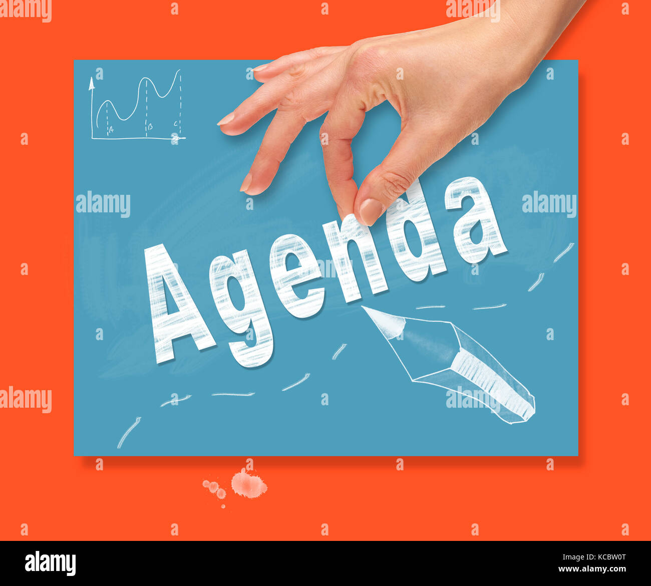 A hand picking up a Agenda concept on a colorful drawing board Stock ...